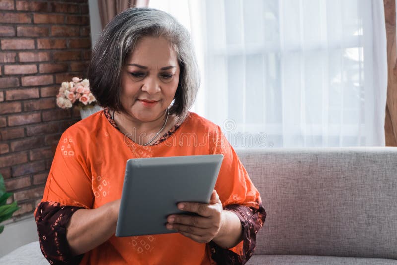 Mature Woman Using Tablet Computer Stock Image - Image of friendly ... Mature Woman Using Tablet Computer Stock Image - Image of friendly ...