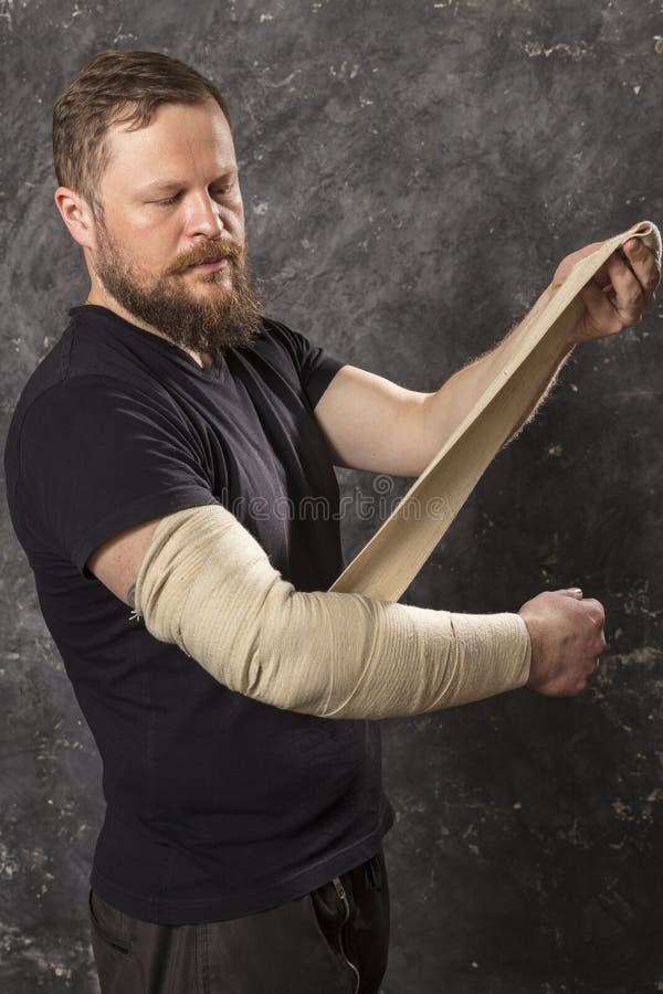 Matured Man with Bandaged Hand Studio Portrait. Stock Image - Image of ...