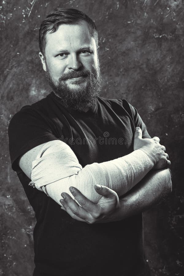 Matured Man with Bandaged Hand Studio Portrait. Stock Image - Image of ...
