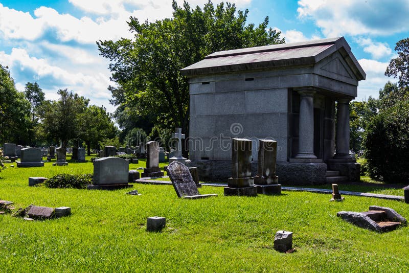 Mausoleum in Graveyard with Scattered Headstones Stock Photo - Image of ...