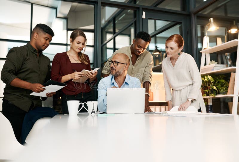 Maximum Effort Gets Maximum Results. a Group of Businesspeople Using a ...