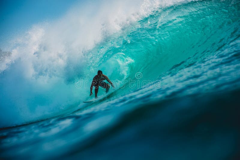 May 12, 2021. Bali, Indonesia. Surfer Ride on Surfboard at Big Barrel ...