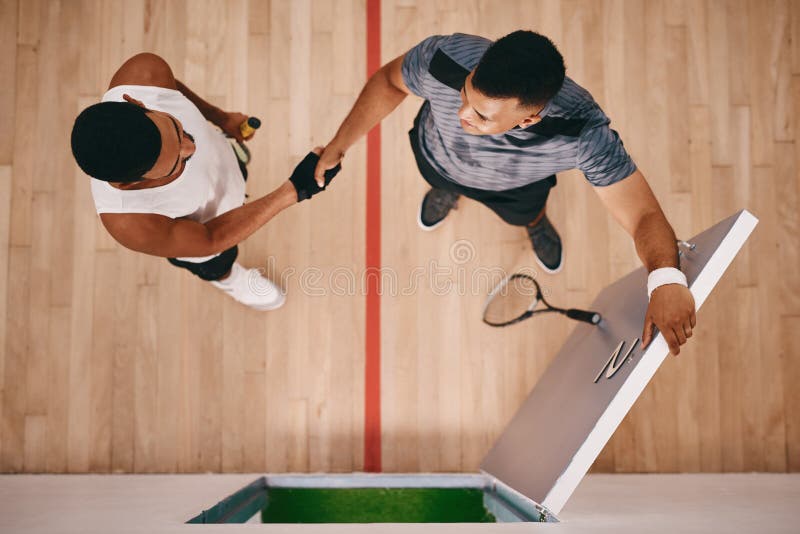 May the Best Man Win. High Angle Shot of Two Young Men Shaking Hands at ... May the Best Man Win. High Angle Shot of Two Young Men Shaking Hands at ...