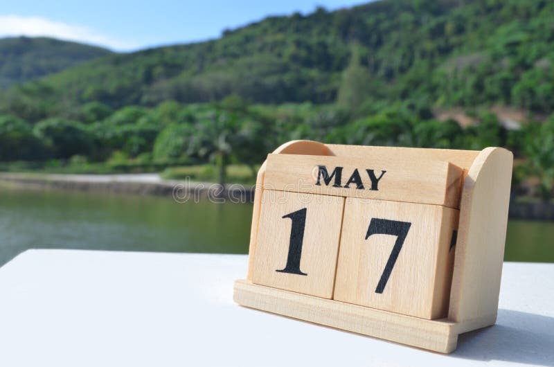 May 17, Date Design with Number Cube on White Table, Cover Design in ...