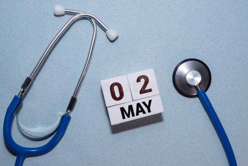 May 2 Wooden Calendar on Green Plant Stock Image - Image of wood ...