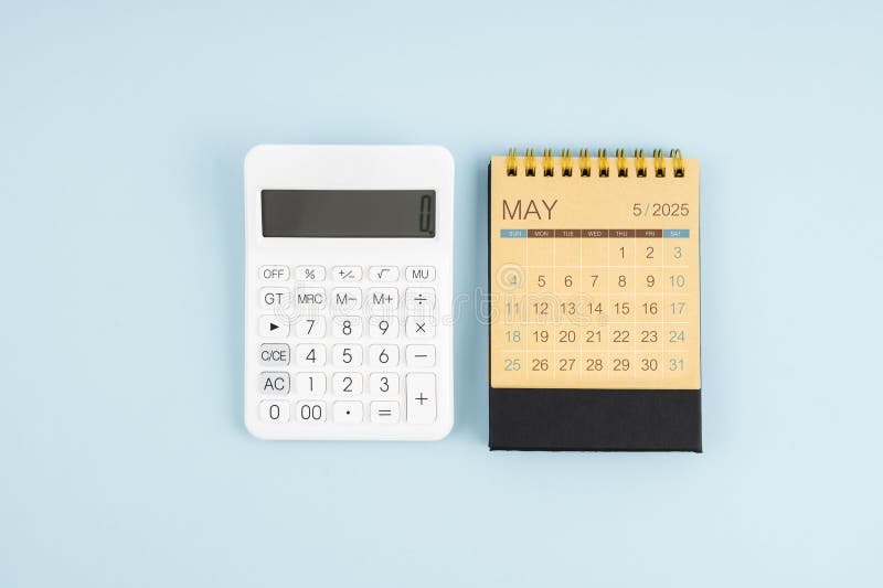 May 2025 Desk Calendar and Calculator on Blue Background Stock Photo ...