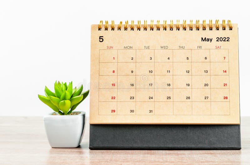 May 2022 Desk Calendar with Plant on Wooden Table Stock Photo - Image ...