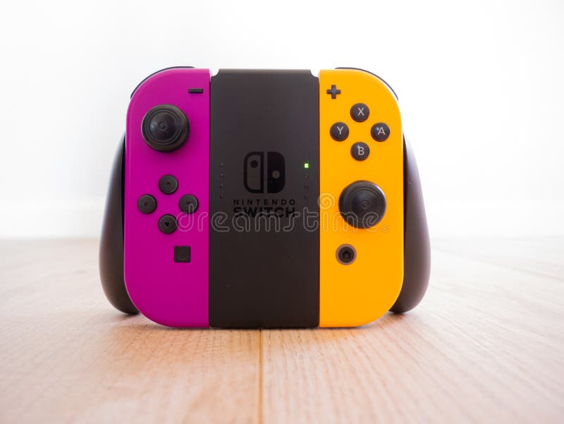 May 2020, UK: Nintendo Switch Grip Controller with Orange and Purple ...