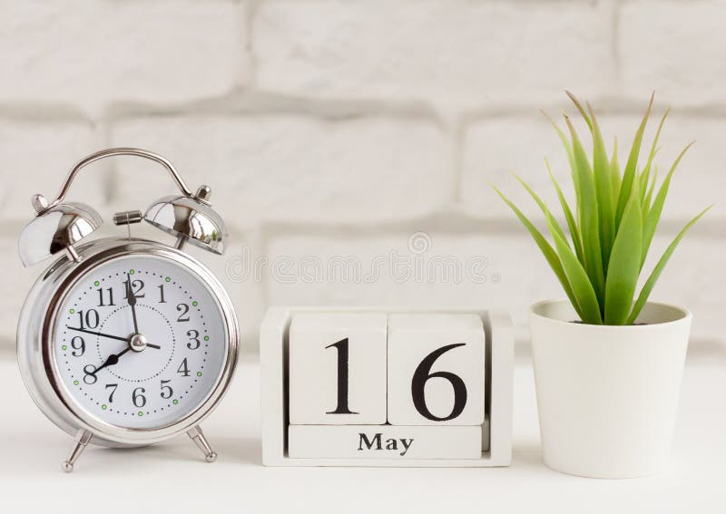 May 24 on a Wooden Calendar Next To an Alarm Clock and a Flower. One ...