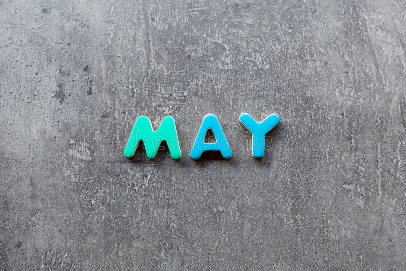 May Word Written with Colorful Letters on Grey Granite Stone Background ...