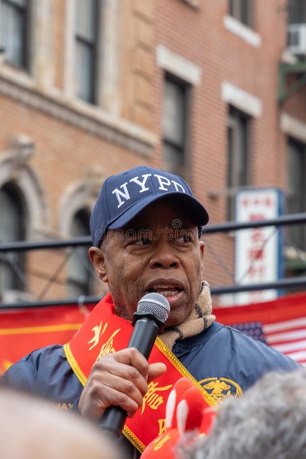 Mayor Eric Adams Standing on a Stage in Front of an Audience Engaging ...