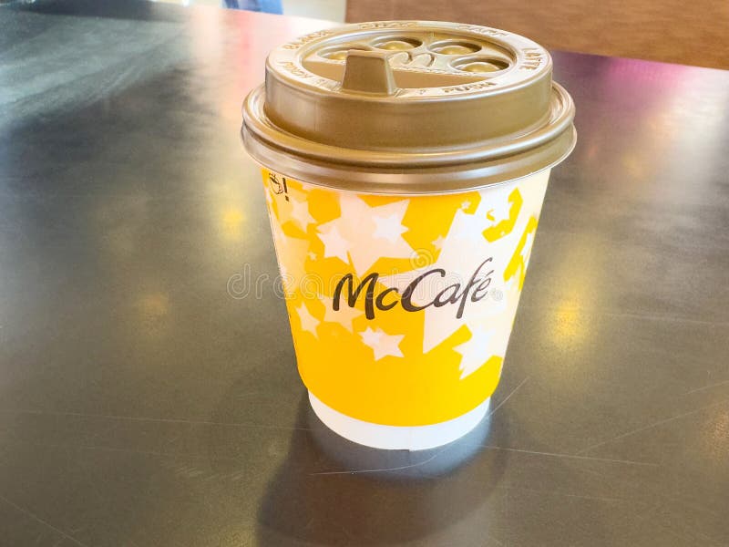 Mccafe Coffee Cup on Table with Yellow Star Design Editorial ...
