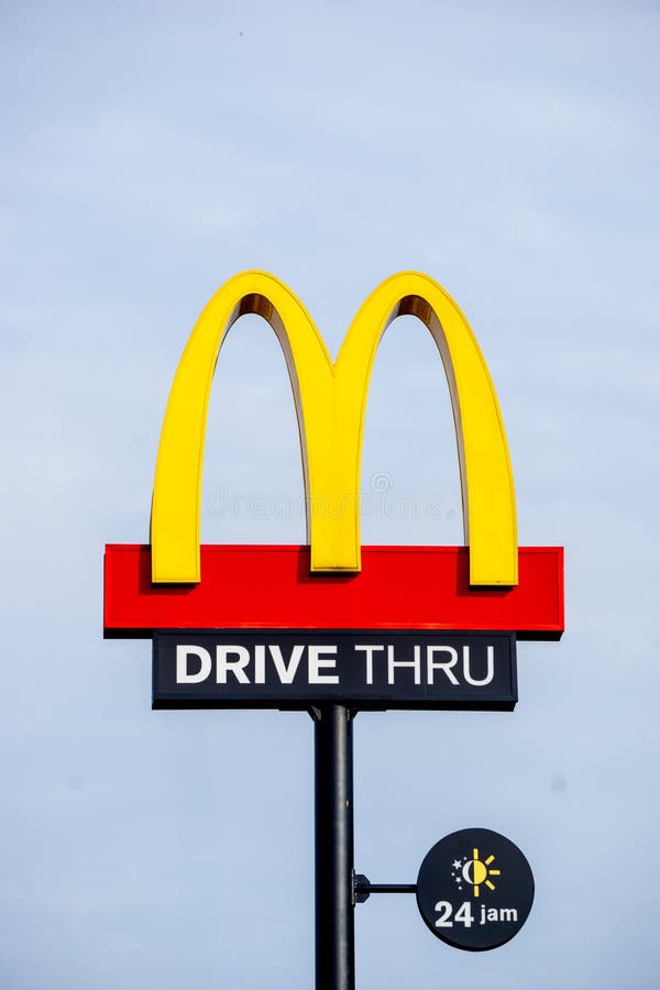 A Mcd (McDonalds) Logo Displayed on Light Box Pole with Drive Thru ...