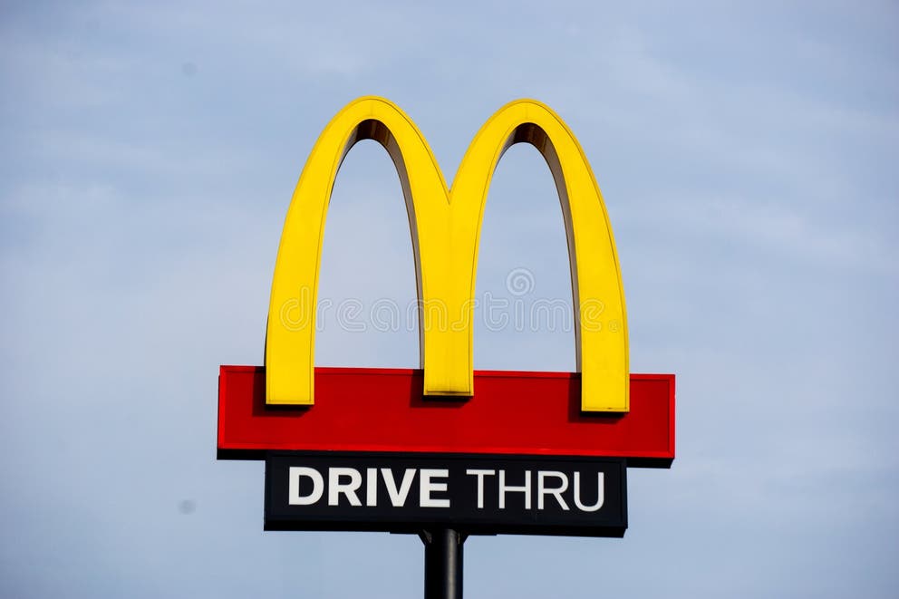 A Mcd (McDonalds) Logo Displayed on Light Box Pole with Drive Thru ...