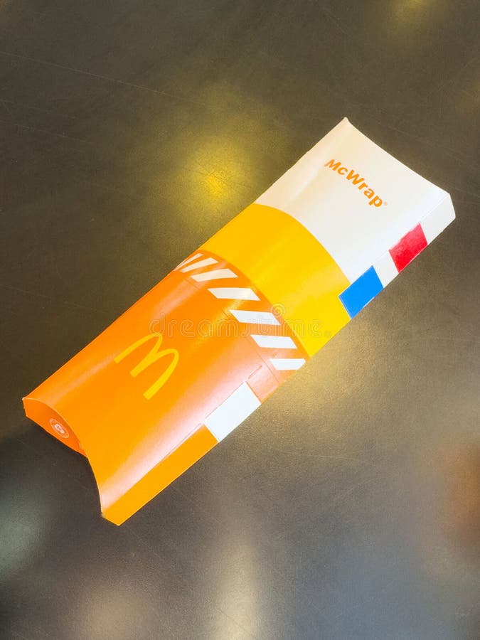 Mcdonald S Mcwrap Package on Dark Surface with Colorful Design ...