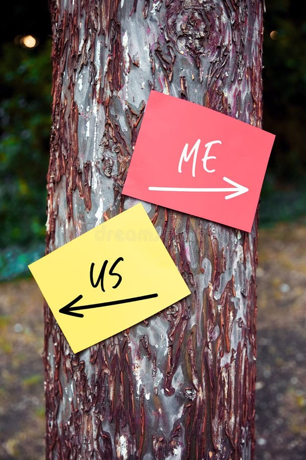 Me Versus Us Words Written on Papers on a Tree with Arrow Signs ...