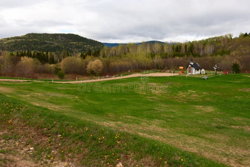 Meadow with tiny church stock image. Image of wooden - 71008803