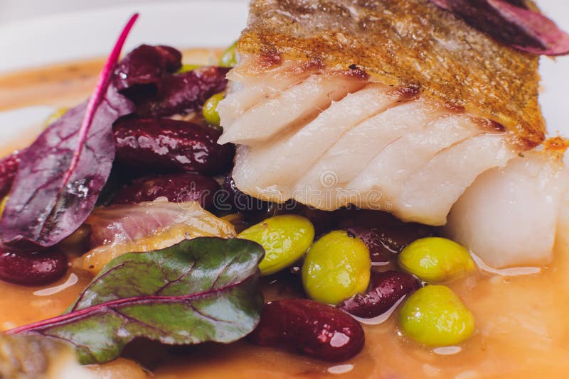 Meal of Boiled Cod Fish with Black Olives and Green Beans. Stock Photo ...