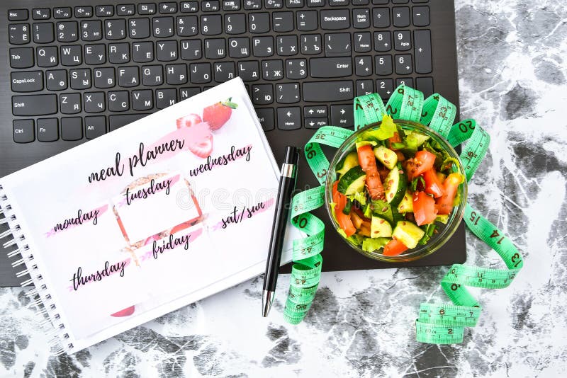 A Meal Plan for a Week. Bowl with Vegetable Salad in the Workplace Near ...
