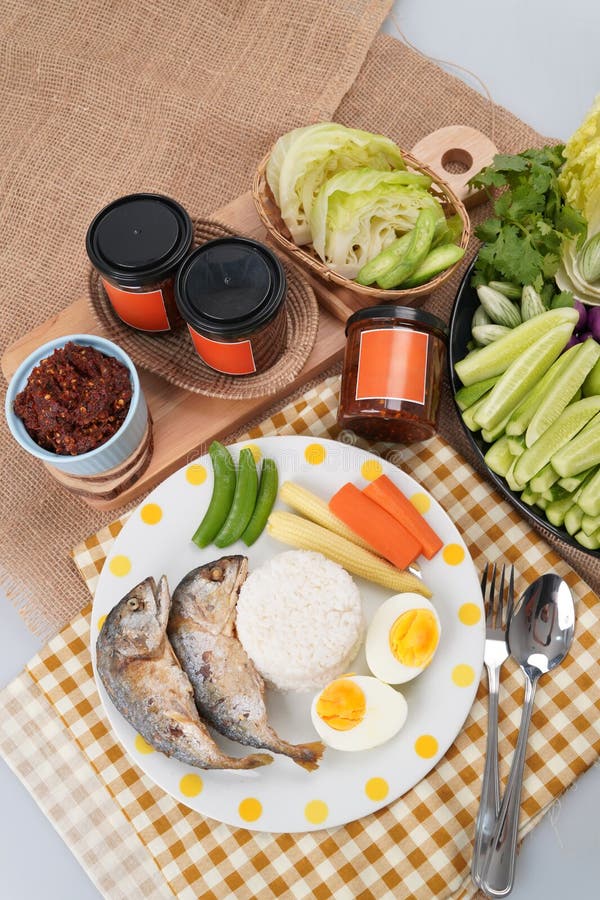 A Meal Setup Featuring a Cup of Thai Chili Paste, a Plate with Two ...