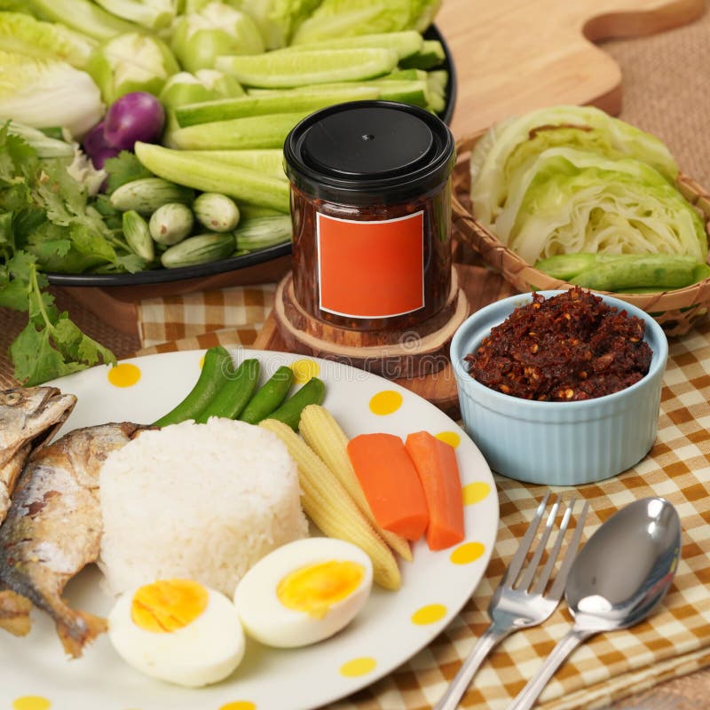A Meal Setup Featuring a Cup of Thai Chili Paste, a Plate with Two ...