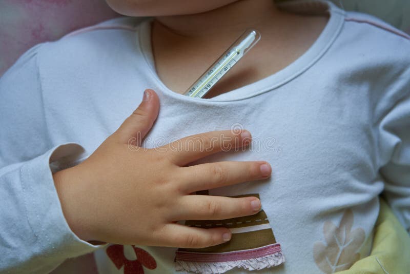 Measure the Child`s Temperature with a Thermometer,a Sick Child Lies on ...