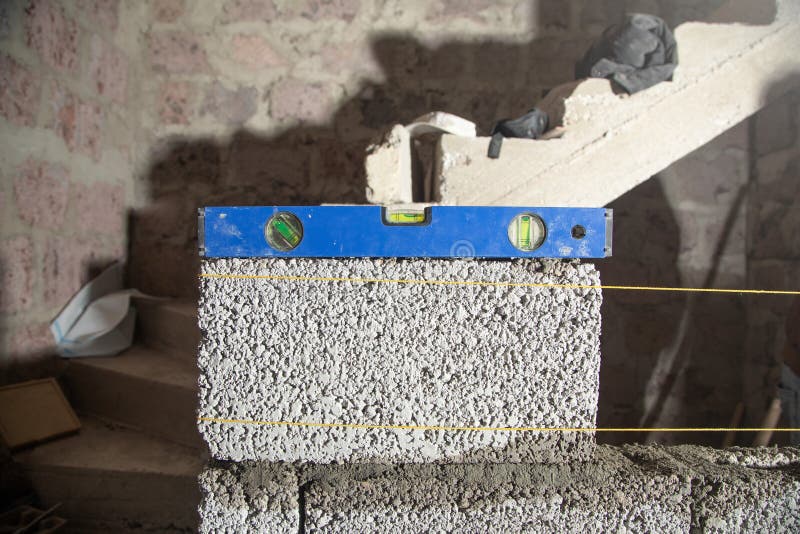 Measure Level on Brick Wall in Construction Site Stock Photo - Image of ...