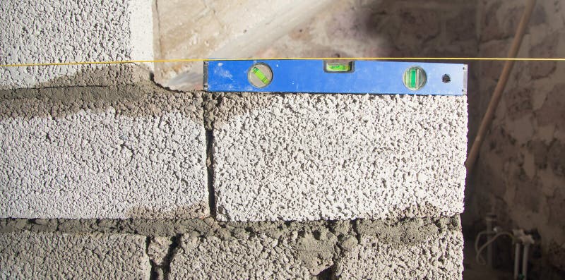 Measure Level on Brick Wall in Construction Site Stock Image - Image of ...
