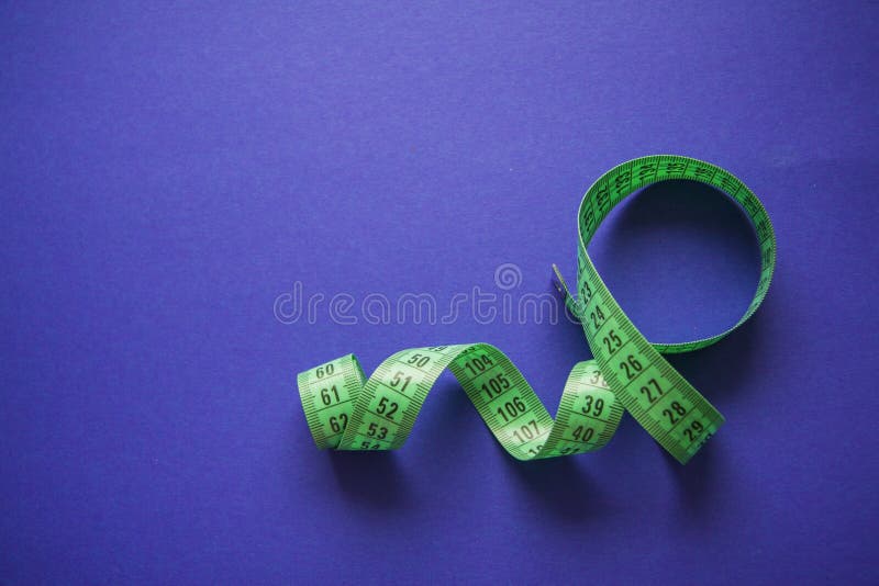 Measure Tape on Blue Background Stock Photo - Image of centimeter ...