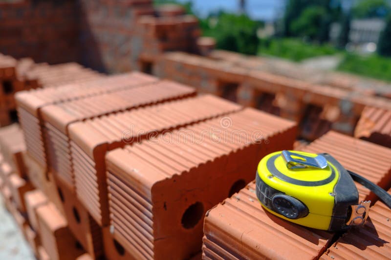 Measure Tape is on the Concrete Floor after Usage for Construction Site ...