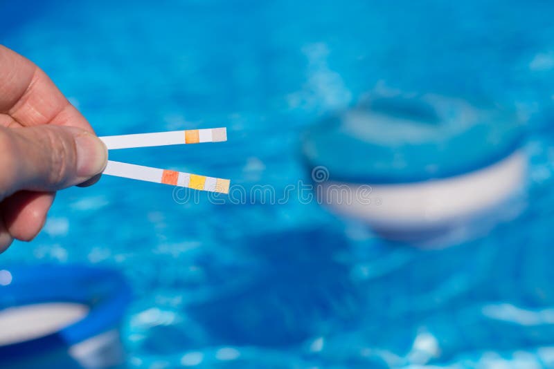 Measure Water Levels in the Pool with Test Strips Stock Photo - Image ...