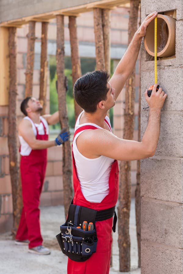 Measurement at Construction Site Stock Image - Image of brick, wall ...