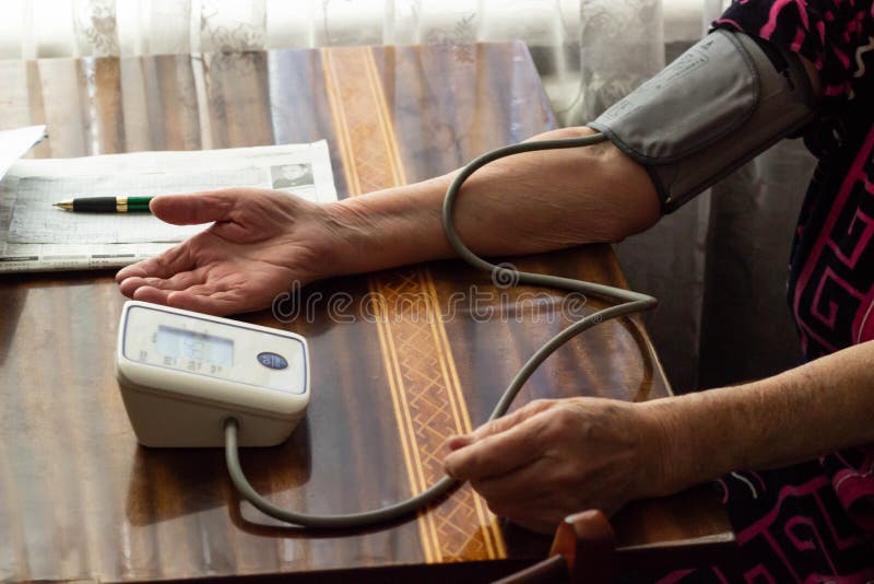 Hands and a Device Measuring Pressure on the Table, a Piece of P Stock ...