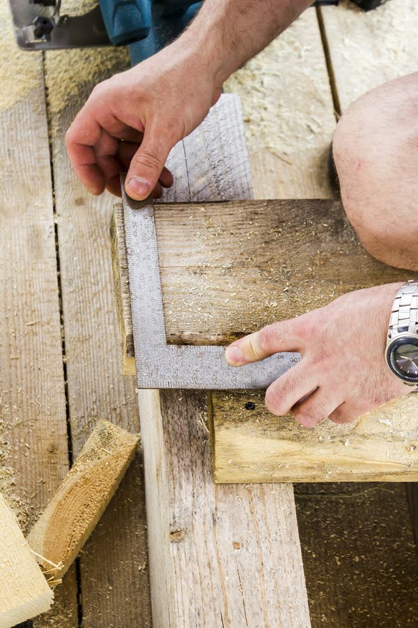 Measurement by a Steel Measuring Angle of a Board Stock Image - Image ...