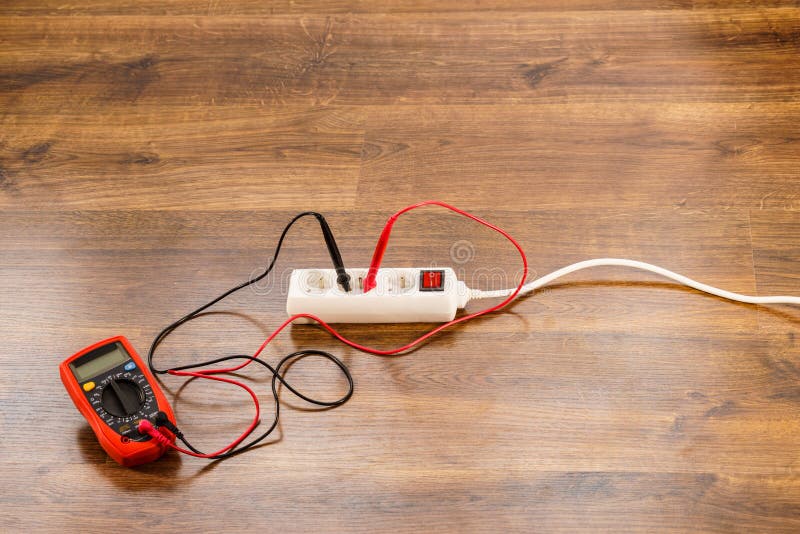 Measurement Voltage in Electrical Socket with Multimeter Stock Image ...