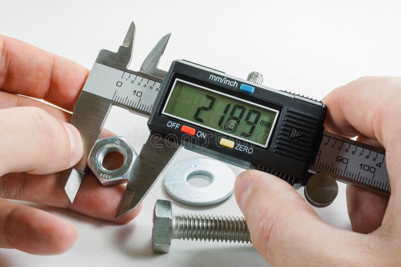 Measurements by a Digital Caliper in the Master`s Hand Stock Photo ...