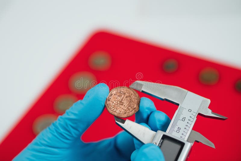 Measuring Ancient Coin Size with Caliper Stock Photo - Image of ancient ...