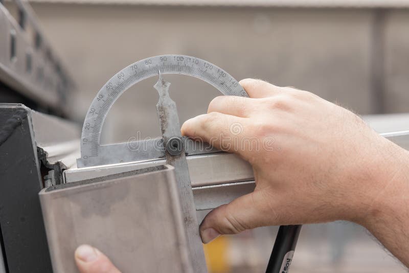 Measuring Angle on Aluminium Profiles with Angle Meter. it is Showing a ...