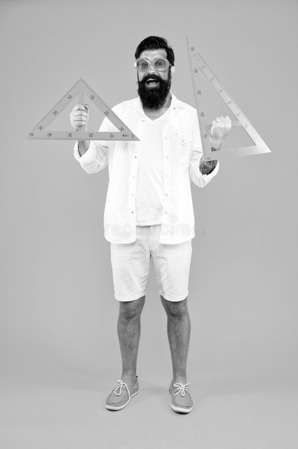 Measuring Angles at Geometry. Geometry Teacher Holding Triangles for ...