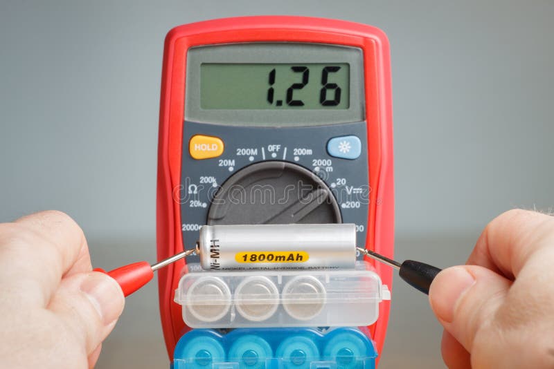 Measuring Battery Voltage with Multimeter Stock Photo - Image of ...