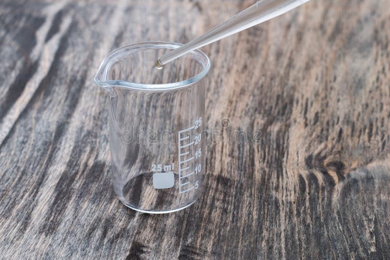 Measuring Beaker on a Table Stock Image - Image of dropper, empty ...