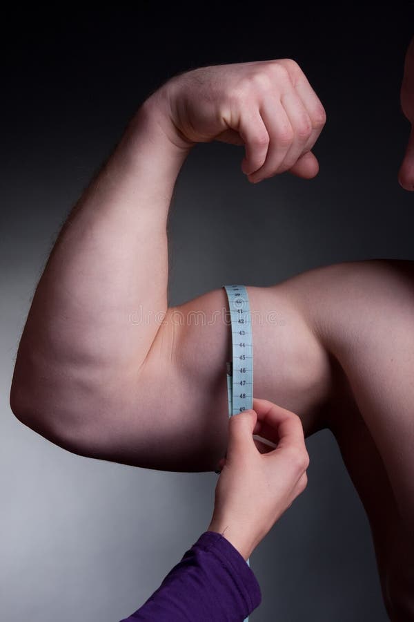 Measuring bicep stock photo. Image of handsome, energy - 19008828