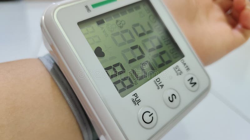 Measuring Blood Pressure with a Blood Pressure Measuring Device Stock ... Measuring Blood Pressure with a Blood Pressure Measuring Device Stock ...