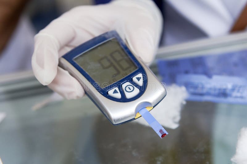 Measuring blood sugar stock photo. Image of analyzing - 27775274
