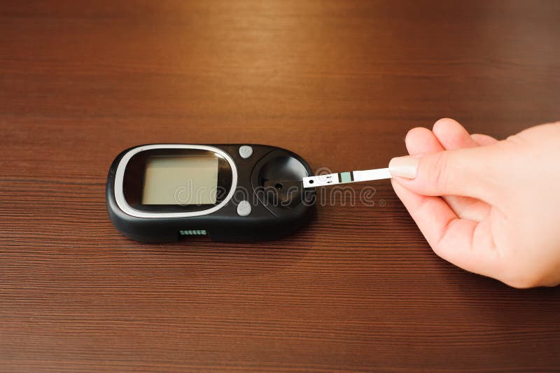 Measuring Blood Sugar with a Blood Glucose Meter. Stock Image - Image ...