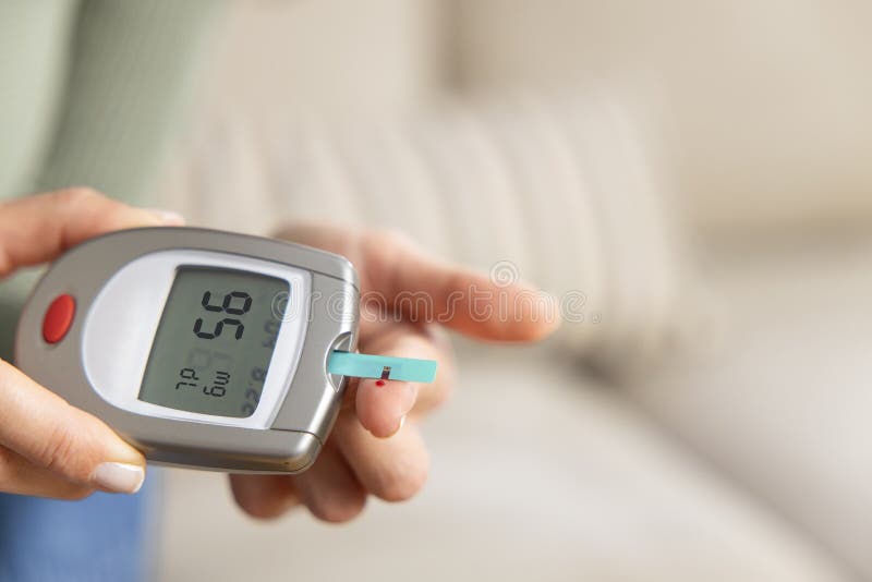Measuring Blood Sugar stock image. Image of indoors - 233059897