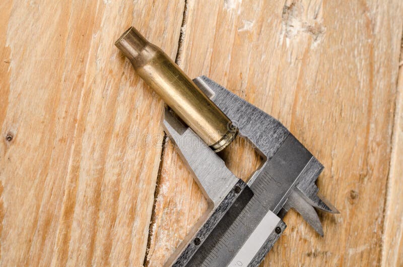 Measuring a bullet stock photo. Image of measurement - 134977828