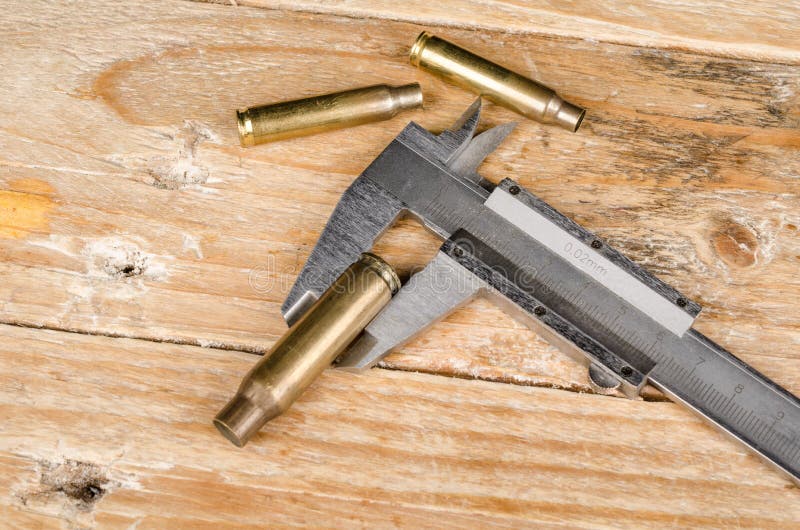 Measuring a bullet stock photo. Image of firearm, measure - 140643342