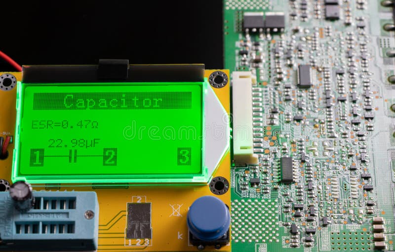Measuring the Capacitance of an Electrolytic Capacitor. Microcircuit on ...