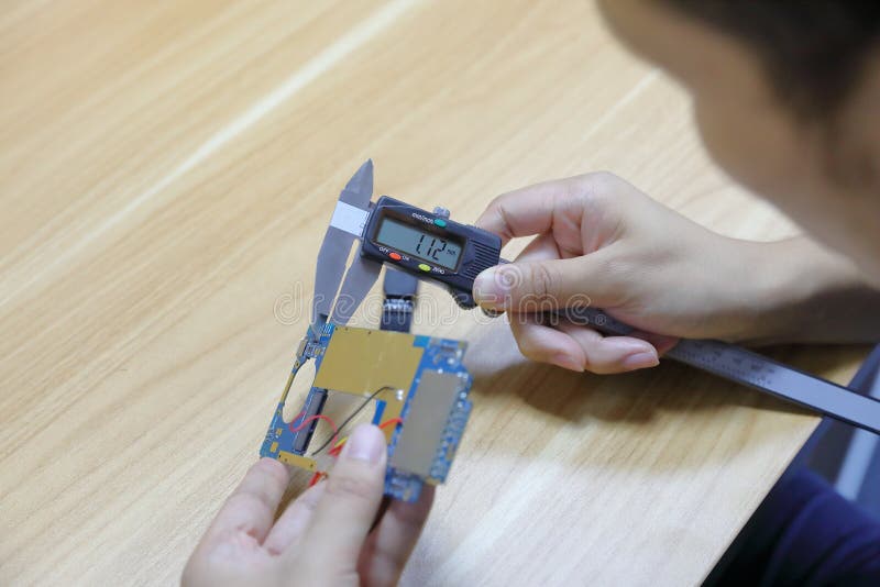 Caliper Measuring a Tool with a Caliper Stock Image - Image of concept ...